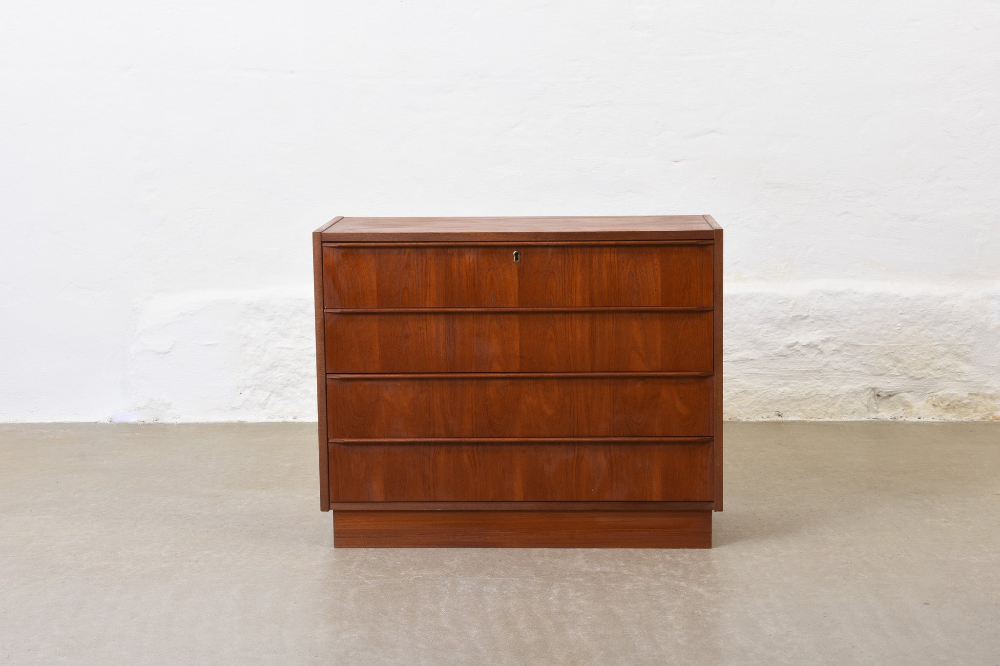 1960s teak chest on plinth base – CHASE & SORENSEN