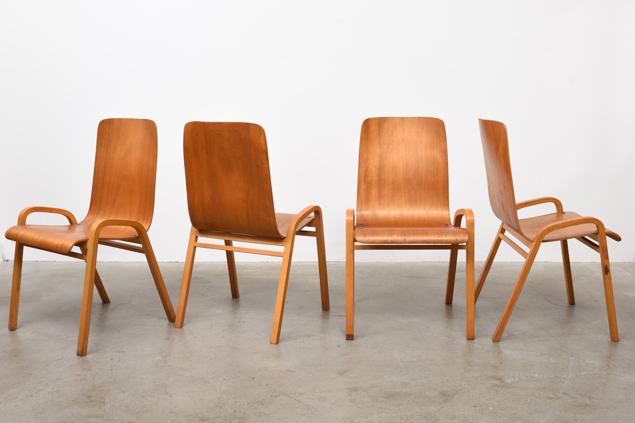 Set of four teak + beech stacking chairs – CHASE & SORENSEN
